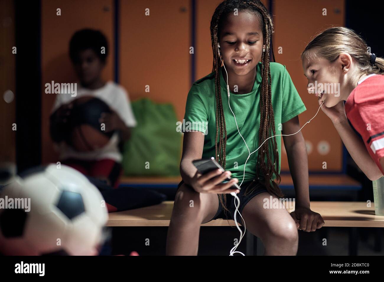 Kids having fun at the locker room before training. Children team sport ...