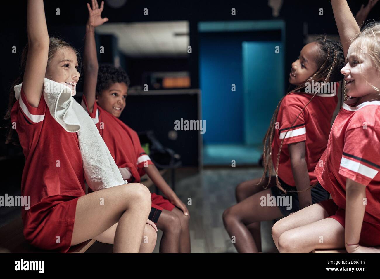 Little players at the locker room ready for the game. Children team ...