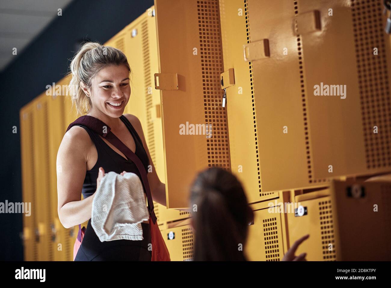 A Young Girls At The Locker Room Chatting And Preparing For A Training