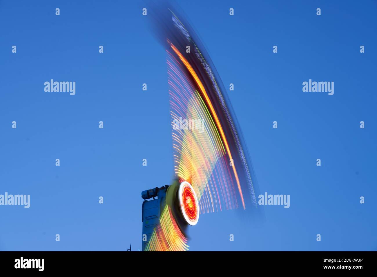 Amusement park blurred effect. Abstract illuminated background Spinning ...