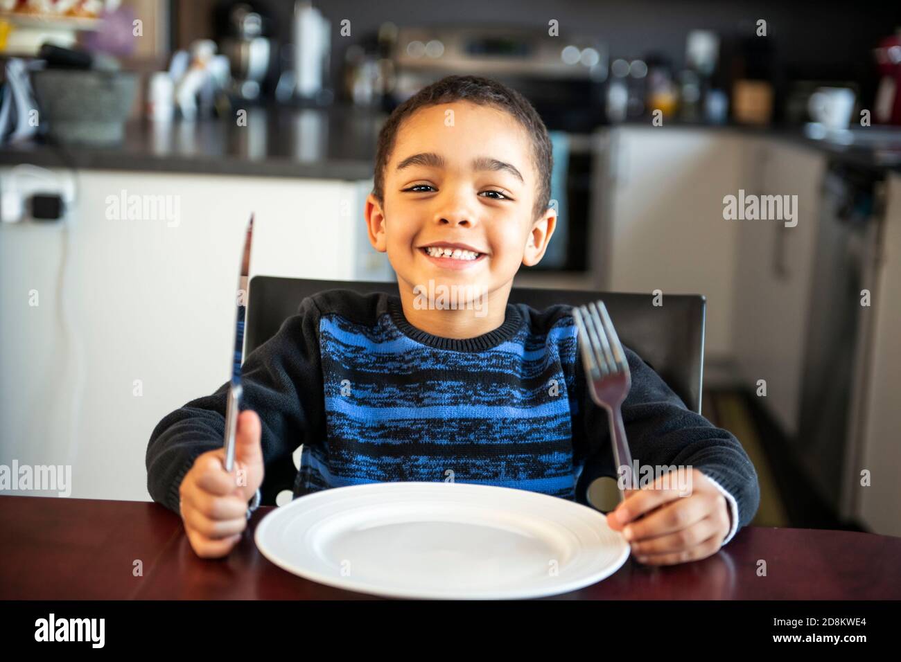 Grumpy boy and dinner hi-res stock photography and images - Alamy