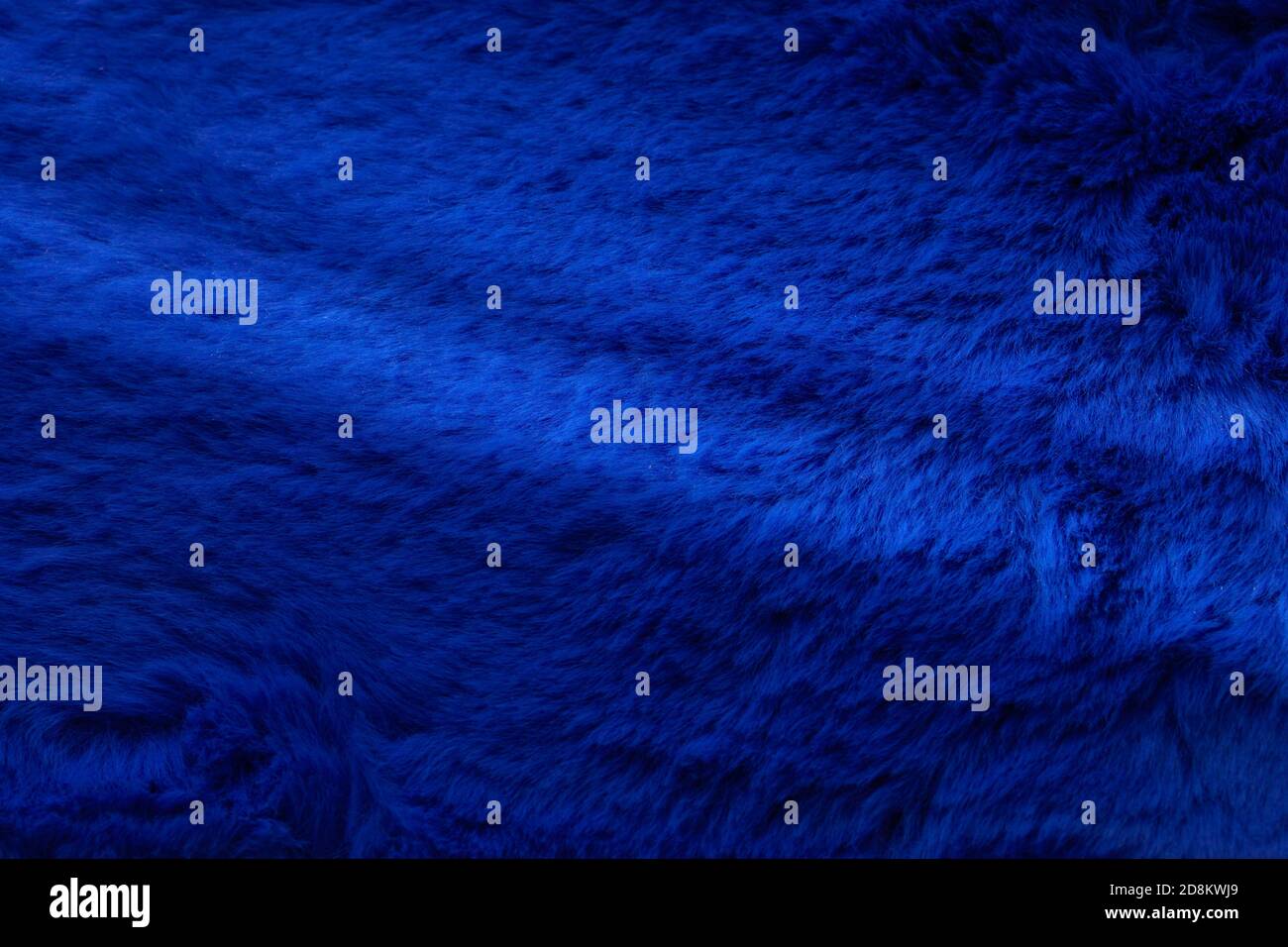 Fluffy soft texture of colored wool of a trendy, saturated dark blue ...