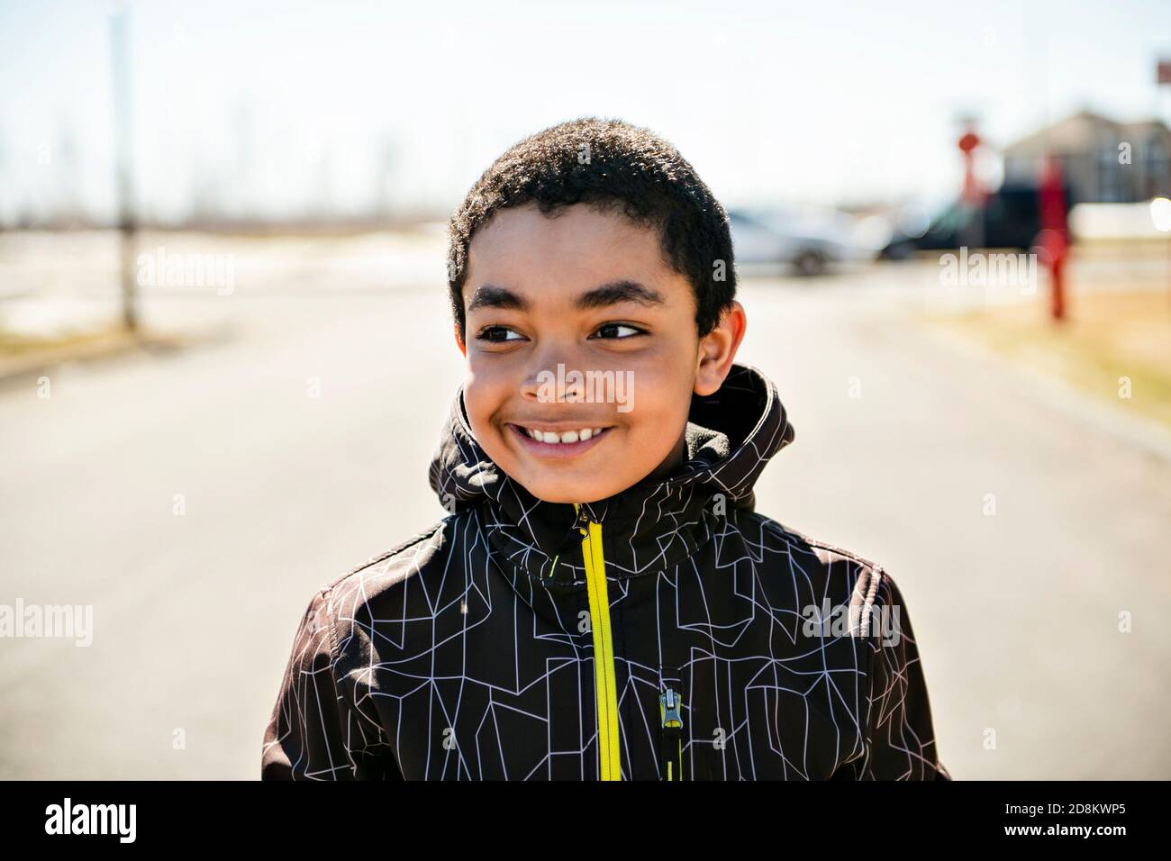 The Children Smiling outside in spring season with coat Stock Photo - Alamy