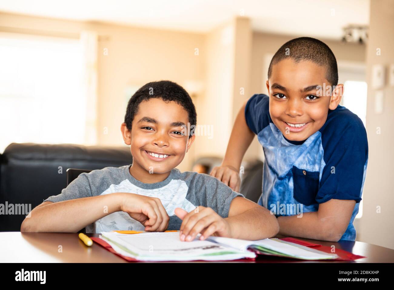 two black brother child doing homework at home Stock Photo - Alamy