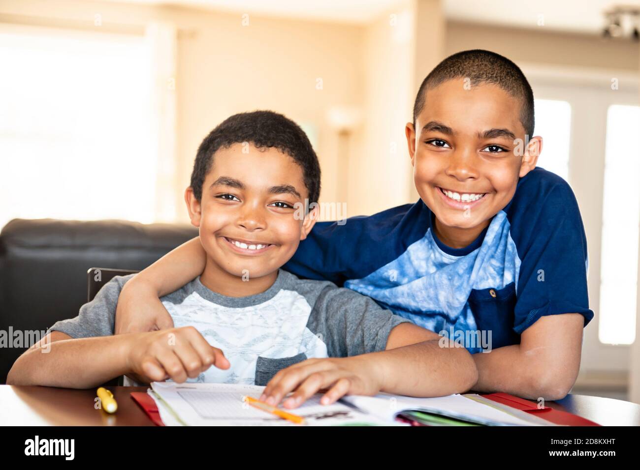 two black brother child doing homework at home Stock Photo - Alamy