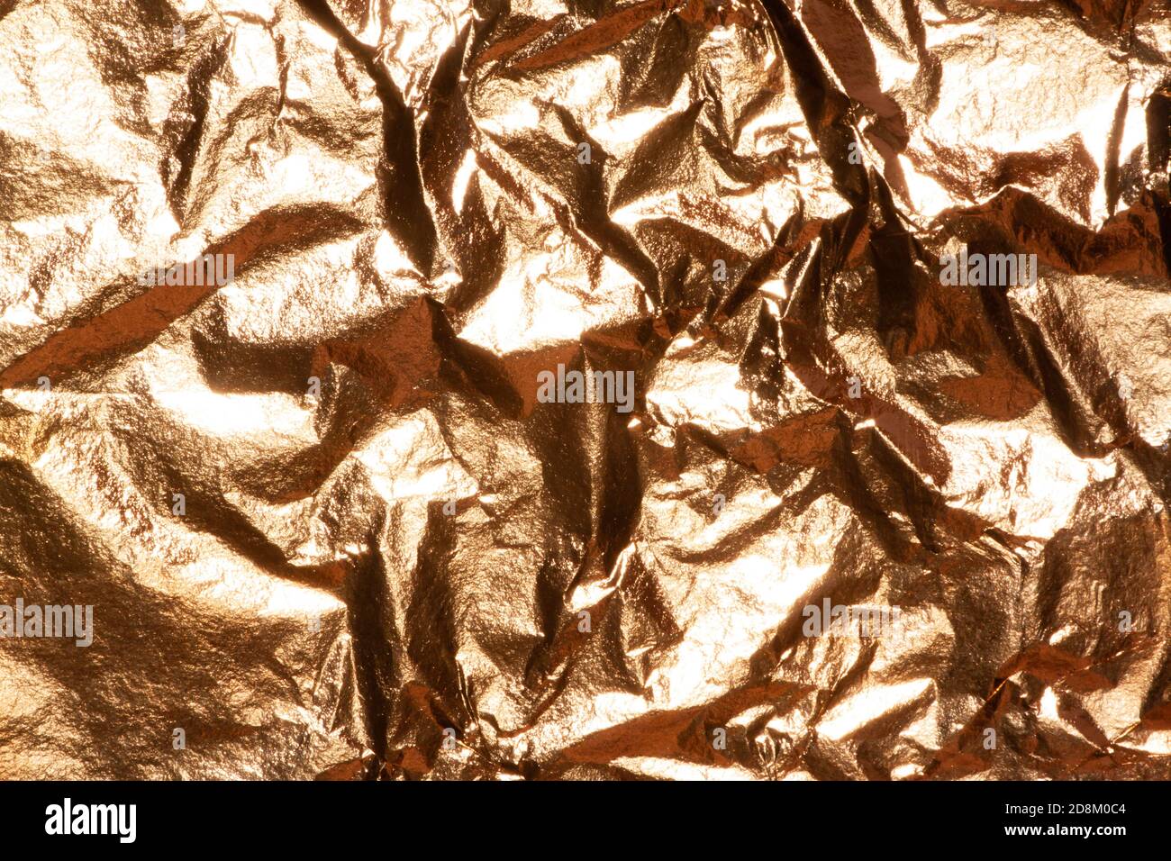 Gold bright shiny texture of a crumpled sheet Stock Photo - Alamy