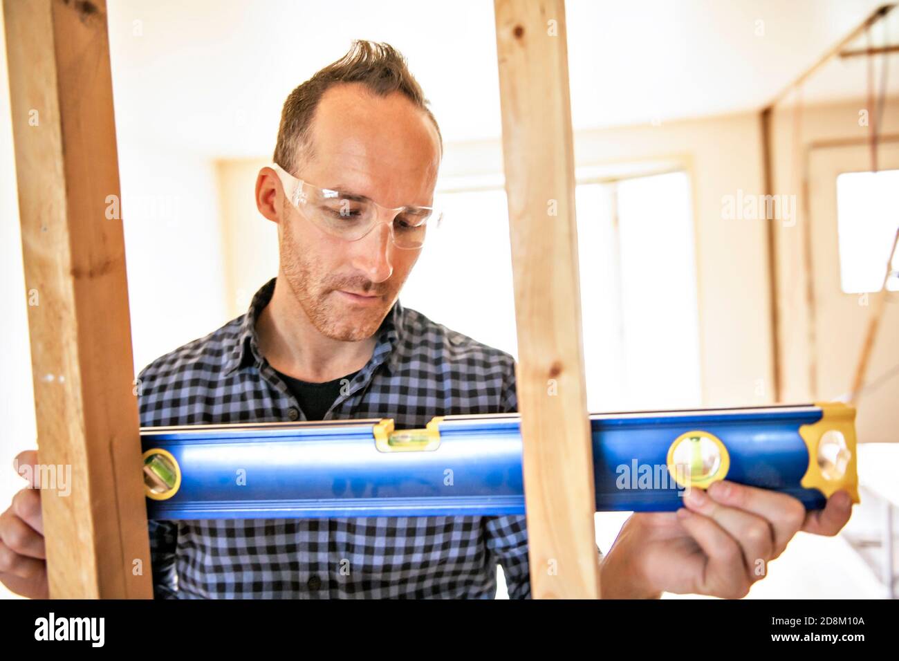 Man professional level tool hi-res stock photography and images - Alamy