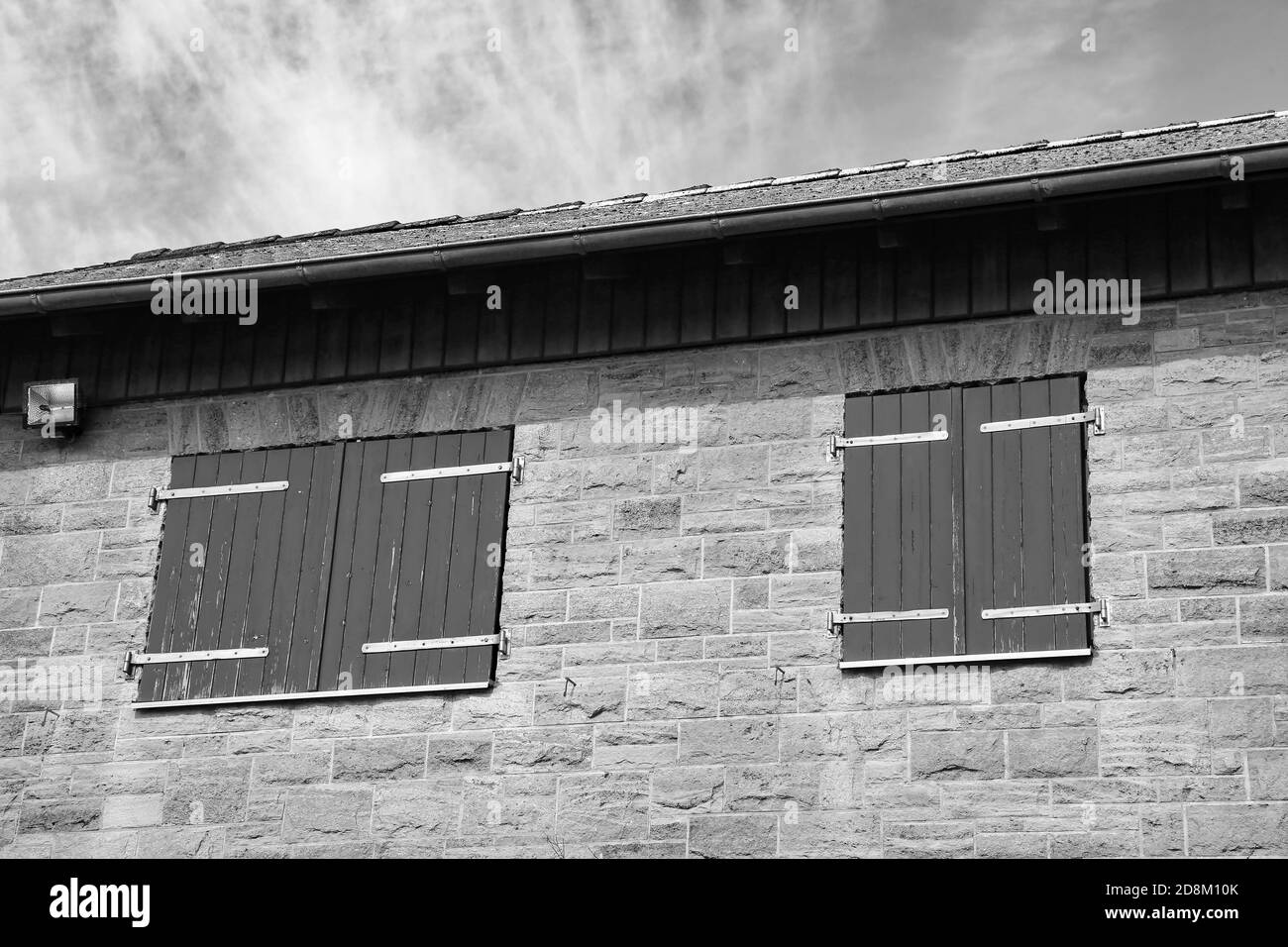 Low angle closeup of windows with shutters in a brick house Stock Photo ...