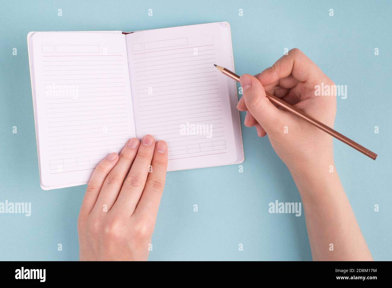 Overhead above close up view photo of female girl hands holding pencil ...