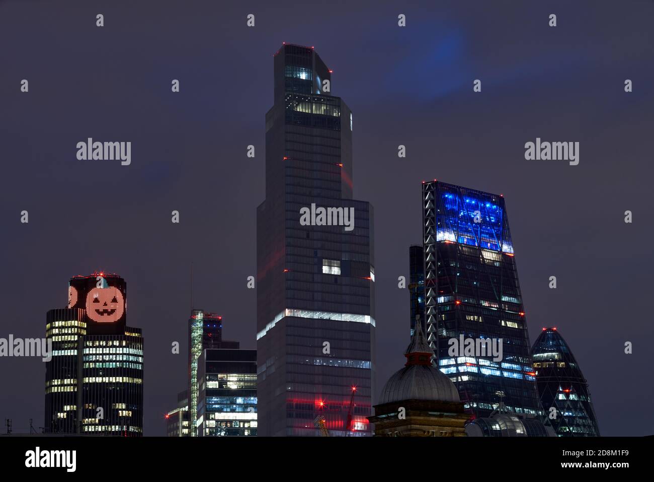A pumpkin is illuminated onto the tower 42 skyscraper, London Stock ...