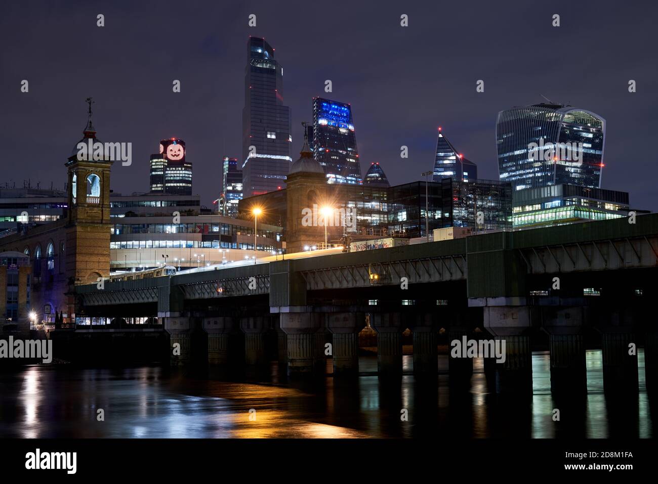 A pumpkin is illuminated onto the tower 42 skyscraper, London Stock ...