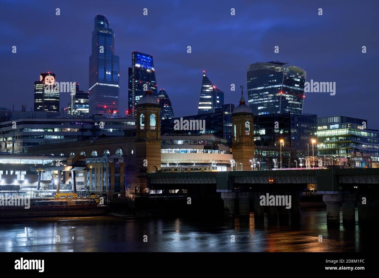 A pumpkin is illuminated onto the tower 42 skyscraper, London Stock ...