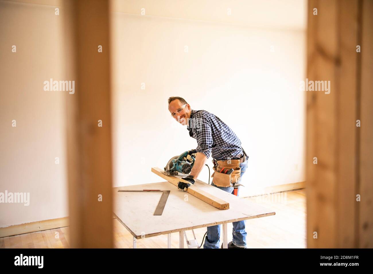 Young man in workroom hi-res stock photography and images - Alamy