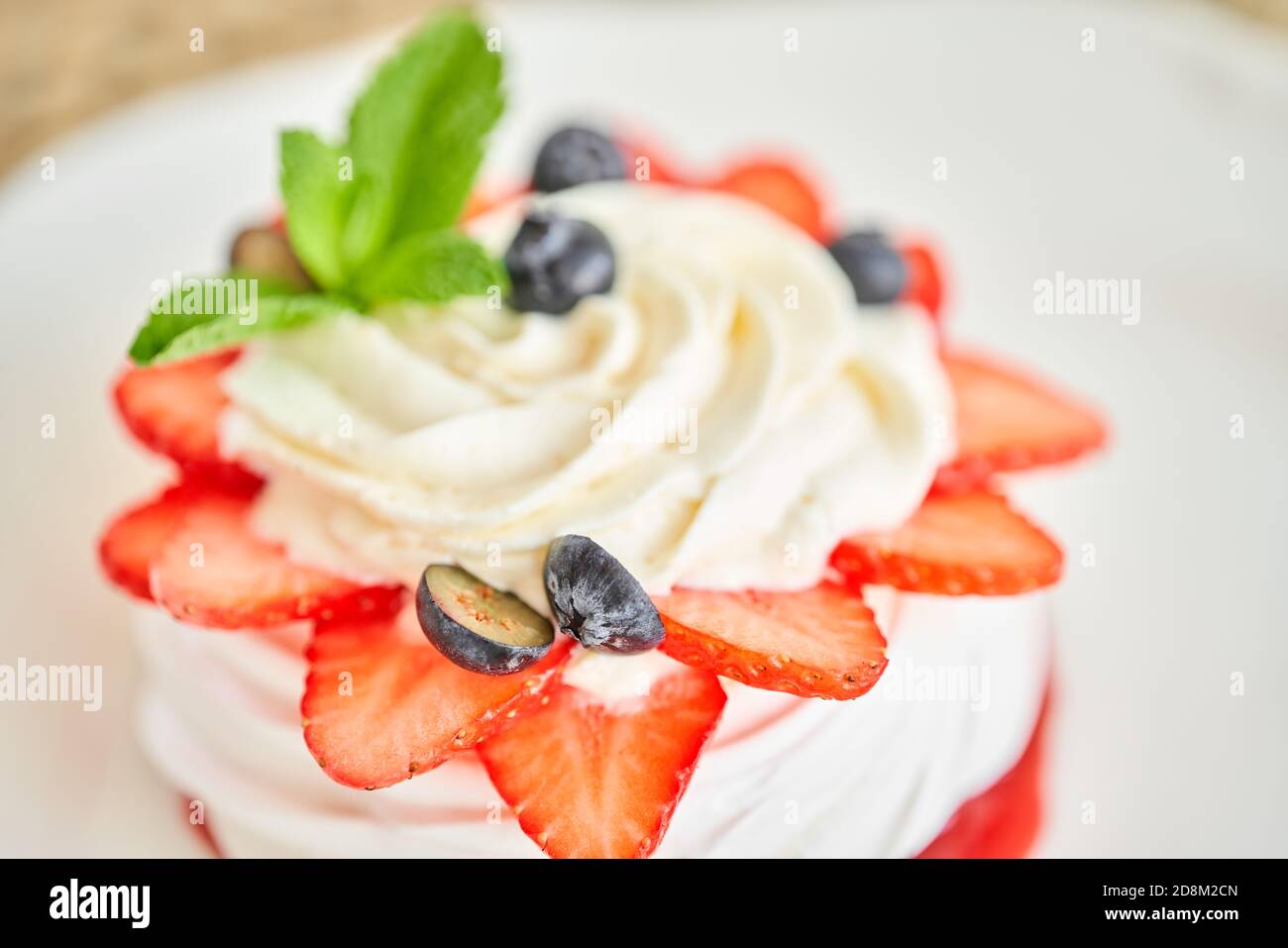 Pavlova is a meringue-based dessert with a crisp crust topped ...