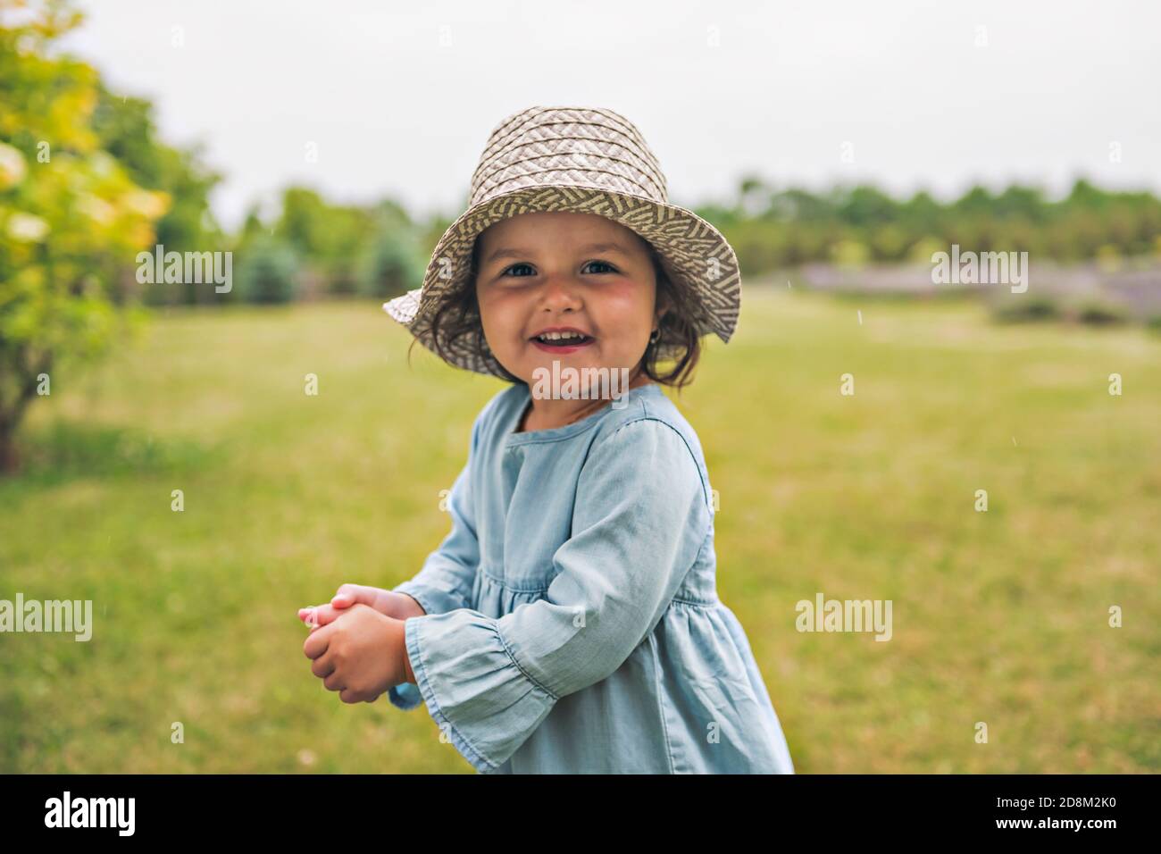 Child in a lavender field. Happy child in nature Stock Photo - Alamy