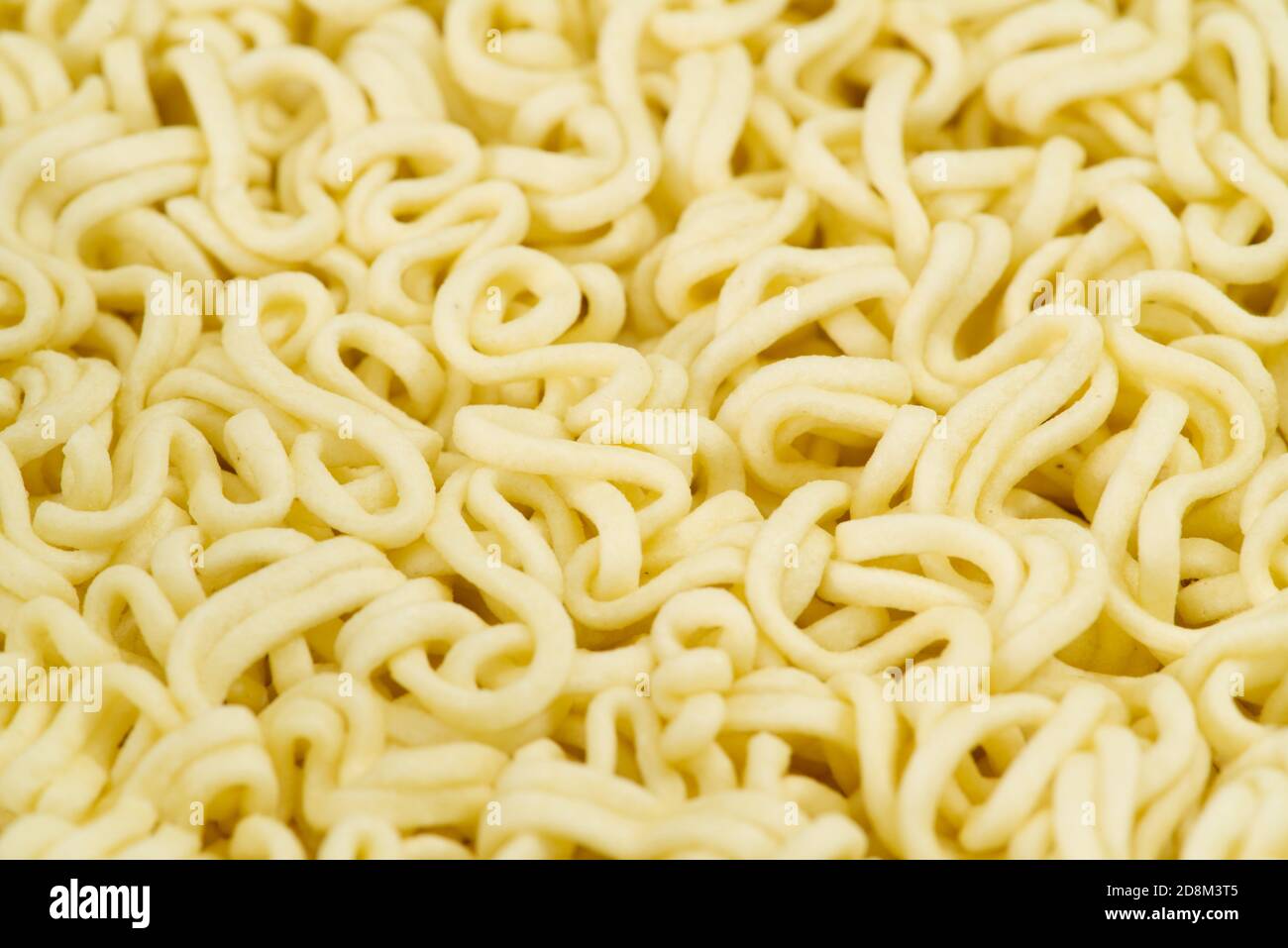 Full frame yellow Instant noodles for background Stock Photo - Alamy