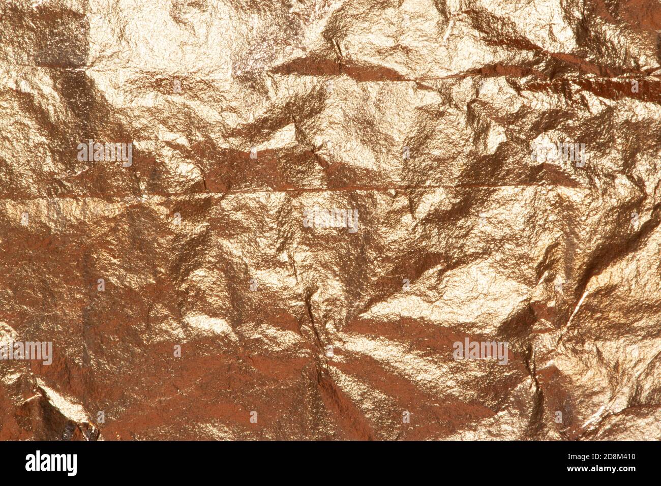 Gold bright shiny real texture of a crumpled sheet Stock Photo - Alamy