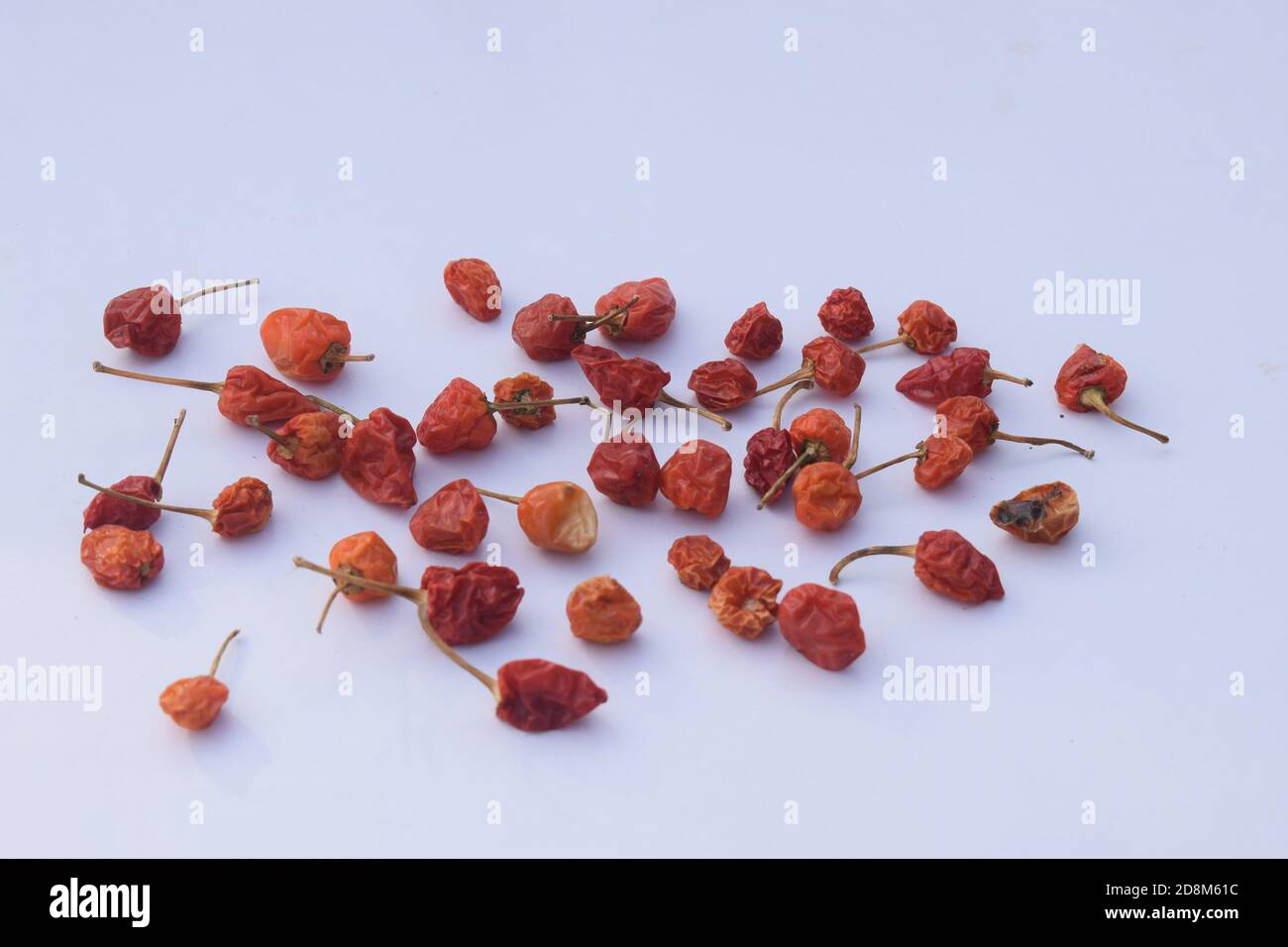 Dry chilli closeup photo on white background Stock Photo - Alamy