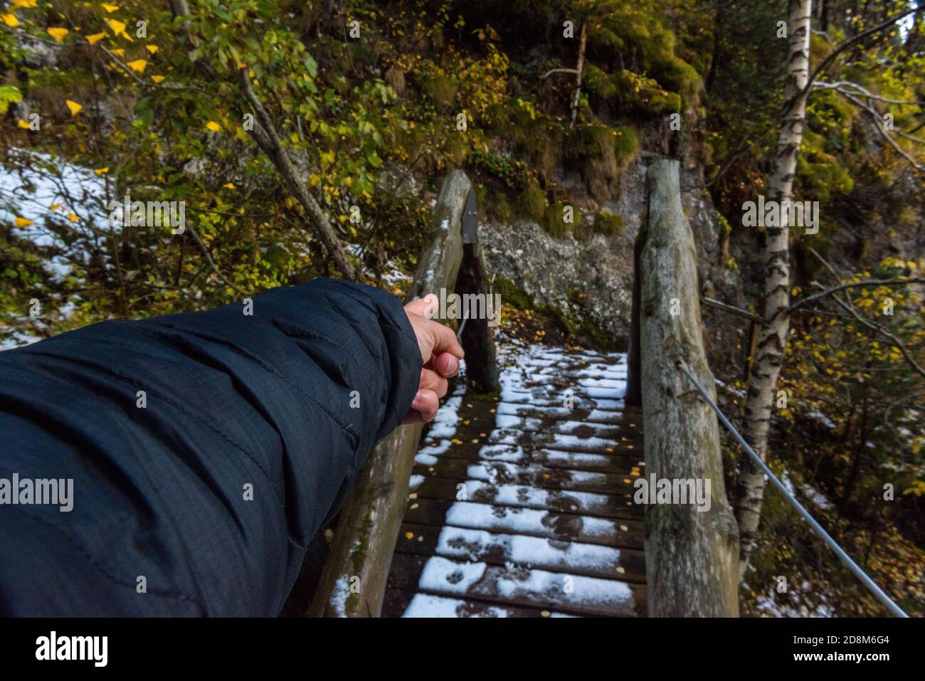 Man points to bridge in the pyrenees Stock Photo - Alamy