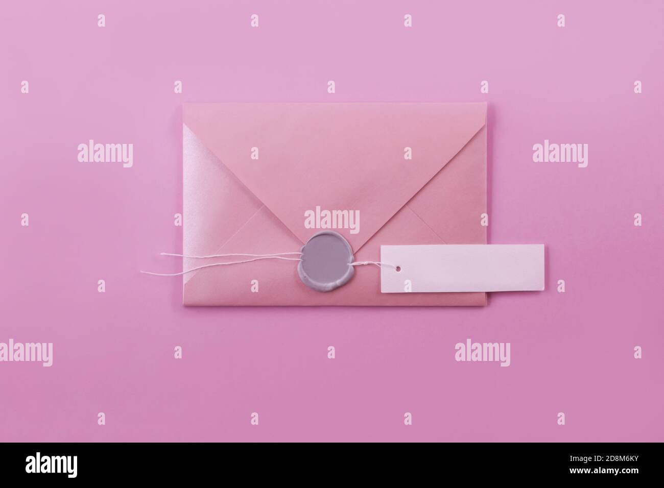 Pink envelope-letter with a wax seal and a paper tag for a signature on ...