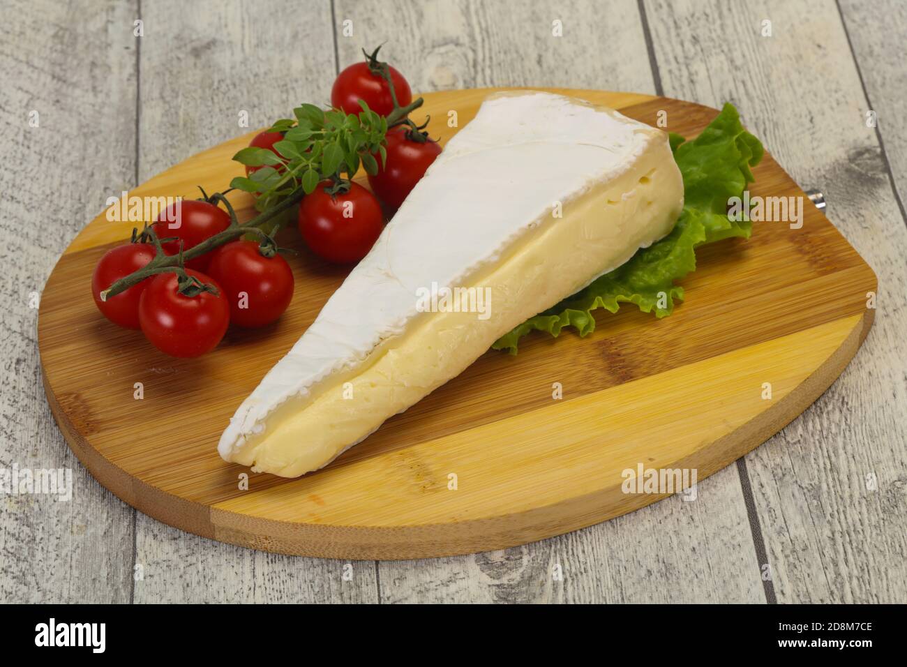 Brie cheese triangle served salad leaves Stock Photo - Alamy