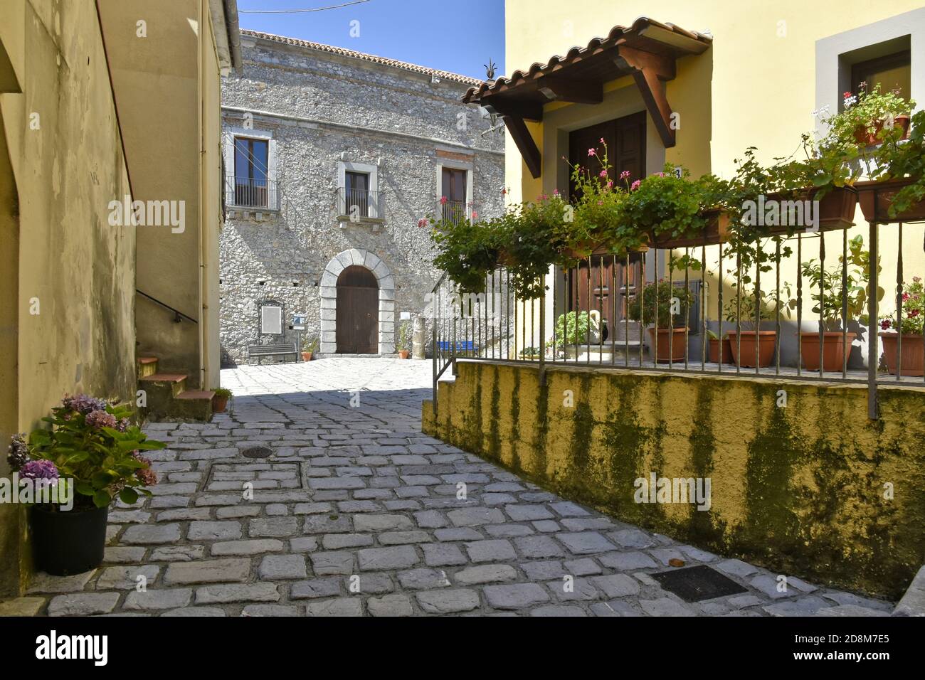 A narrow street among the old houses of Aieta, a rural village in the ...