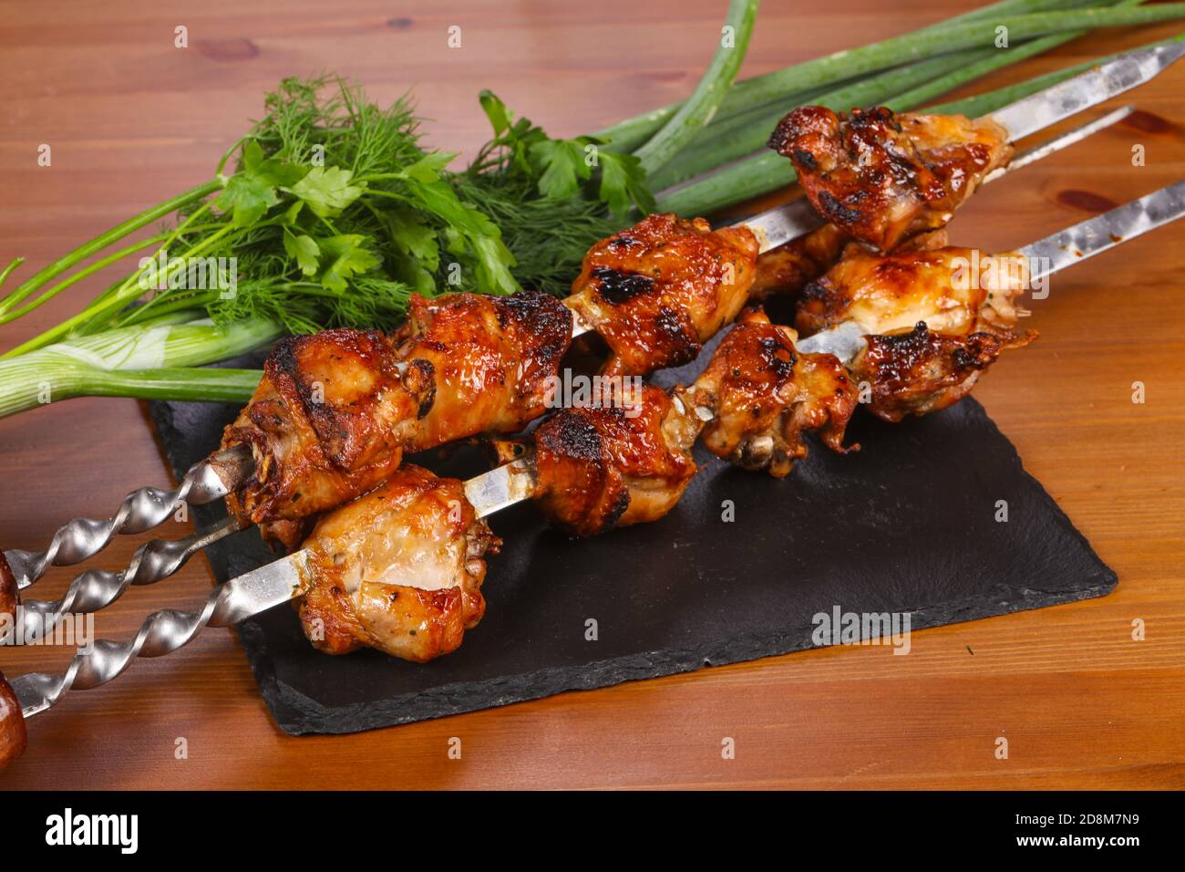Chicken shashlik kebab on the sticks with herbs Stock Photo - Alamy