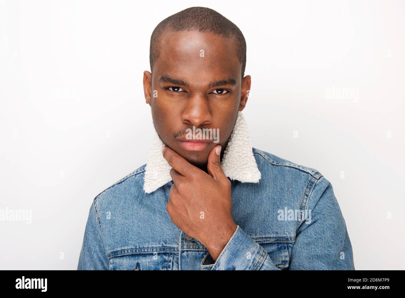 Close up portrait of cool young african american man in denim jacket ...