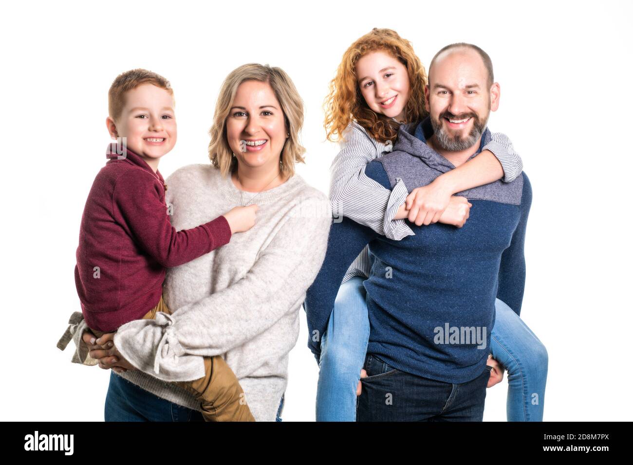 A Beautiful happy family together on studio white background Stock ...