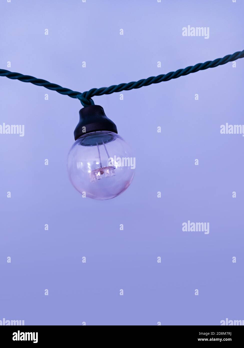 Hanging light one bulb with glowing one different idea on light blue ...