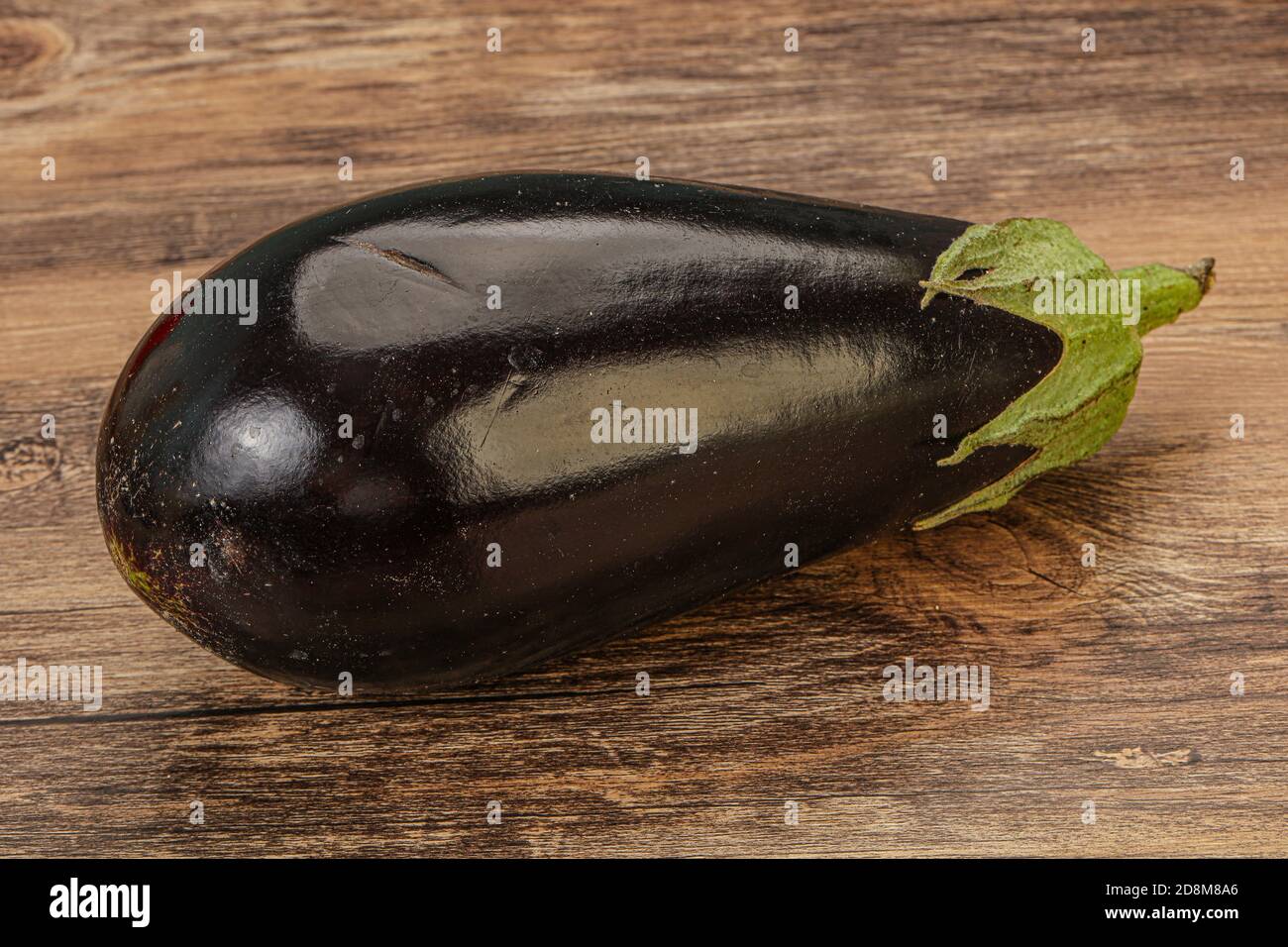 Black ripe fresh one eggplant over background Stock Photo - Alamy