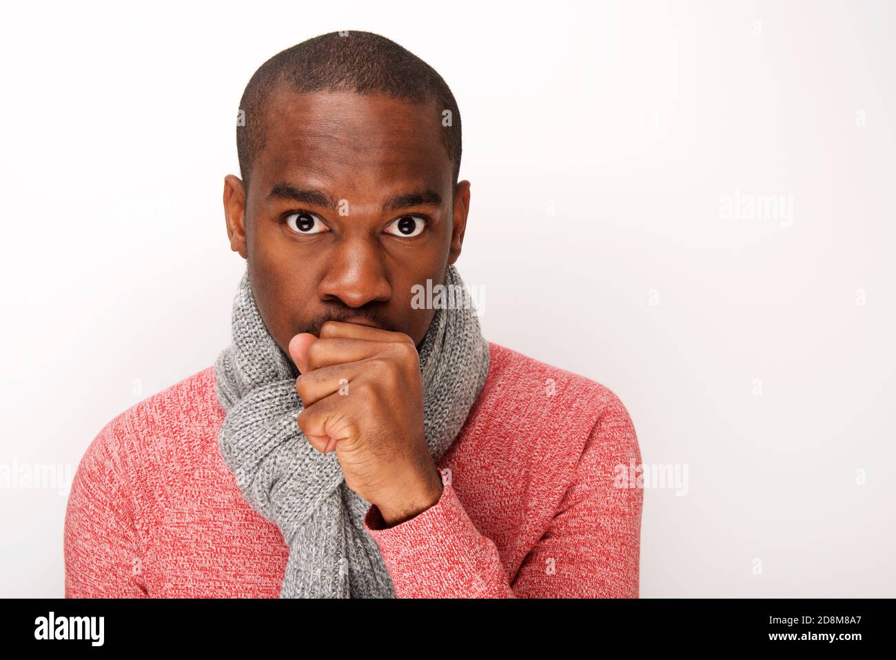 Close up portrait of young black man keeping warm with scarf Stock ...