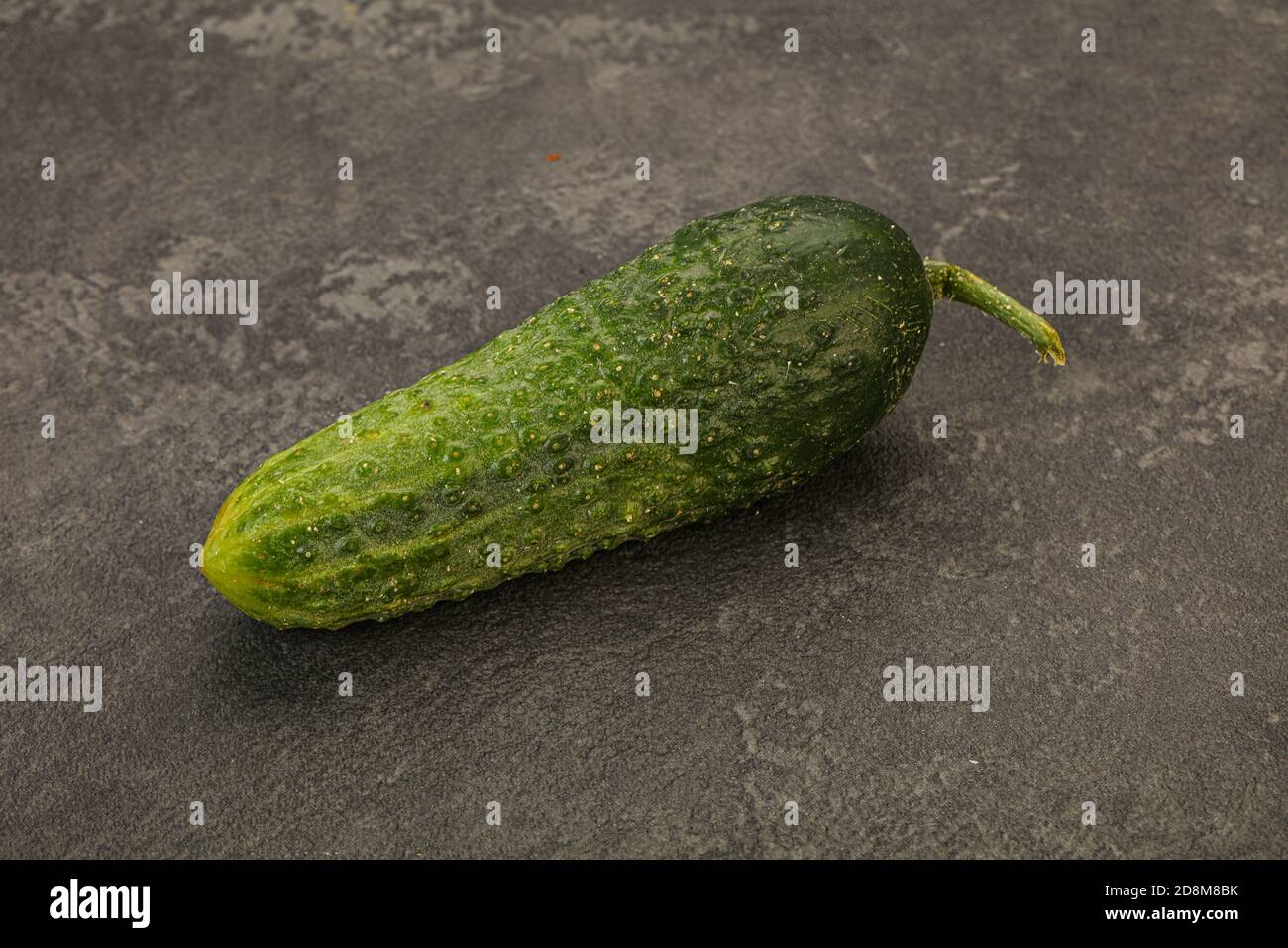 Green ripe fresh one cucumber over background Stock Photo - Alamy