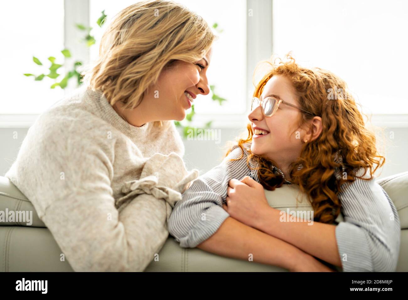 mother and daughter having good time in the living room Stock Photo - Alamy