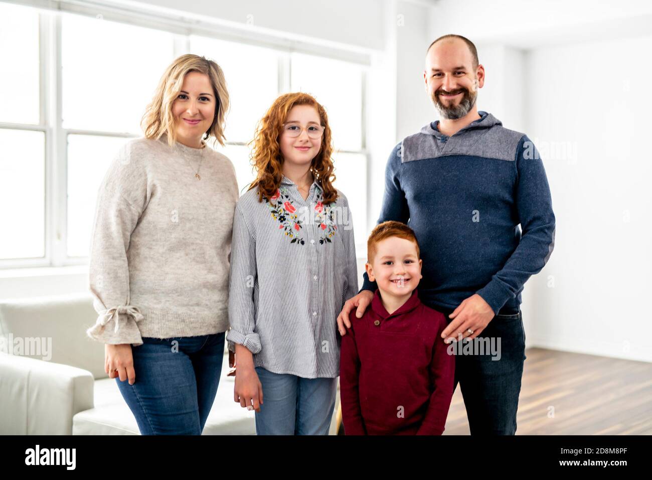 A Beautiful happy family together at home Stock Photo - Alamy