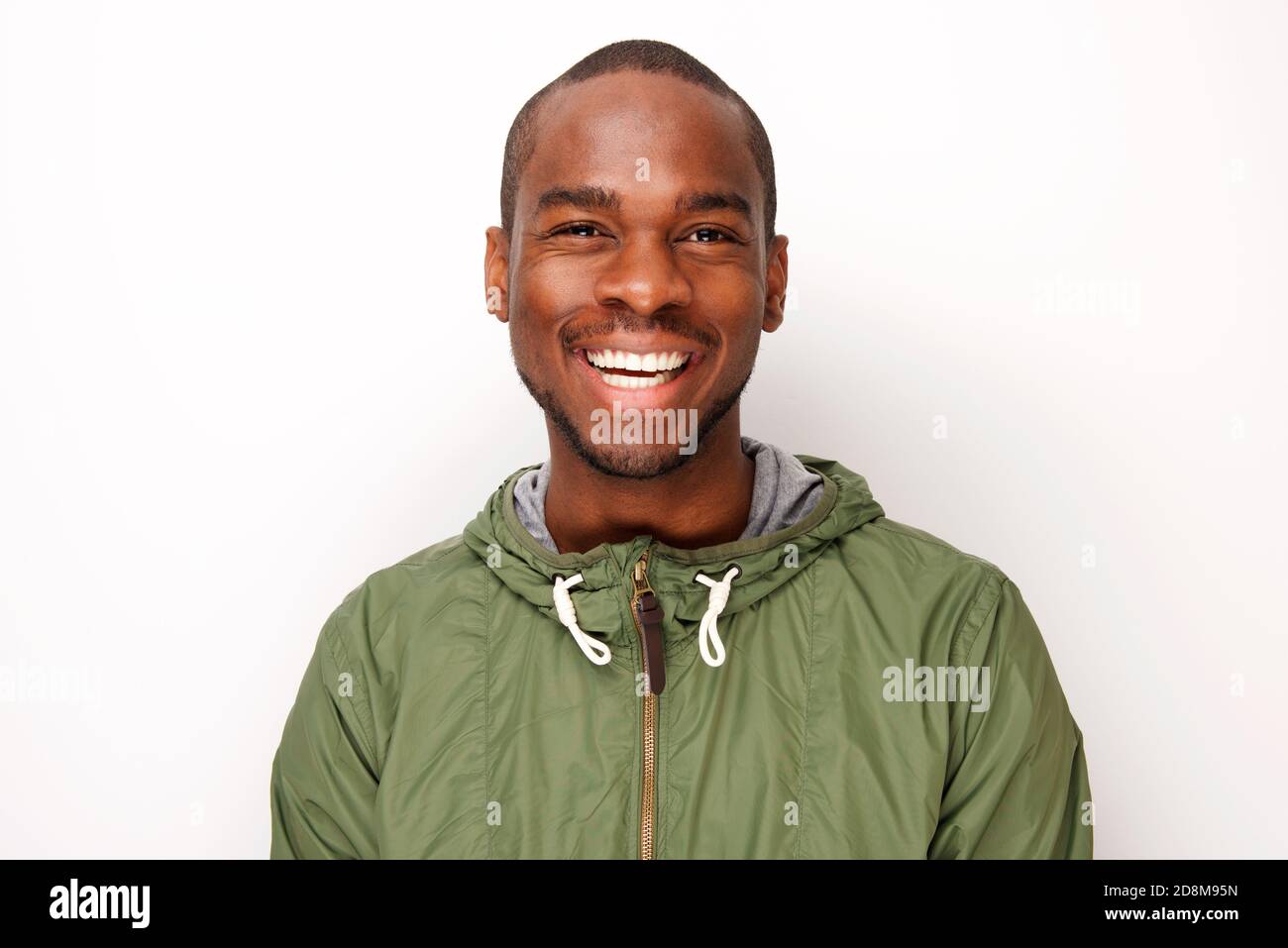 Close up portrait of smiling young black man with windbreaker against ...