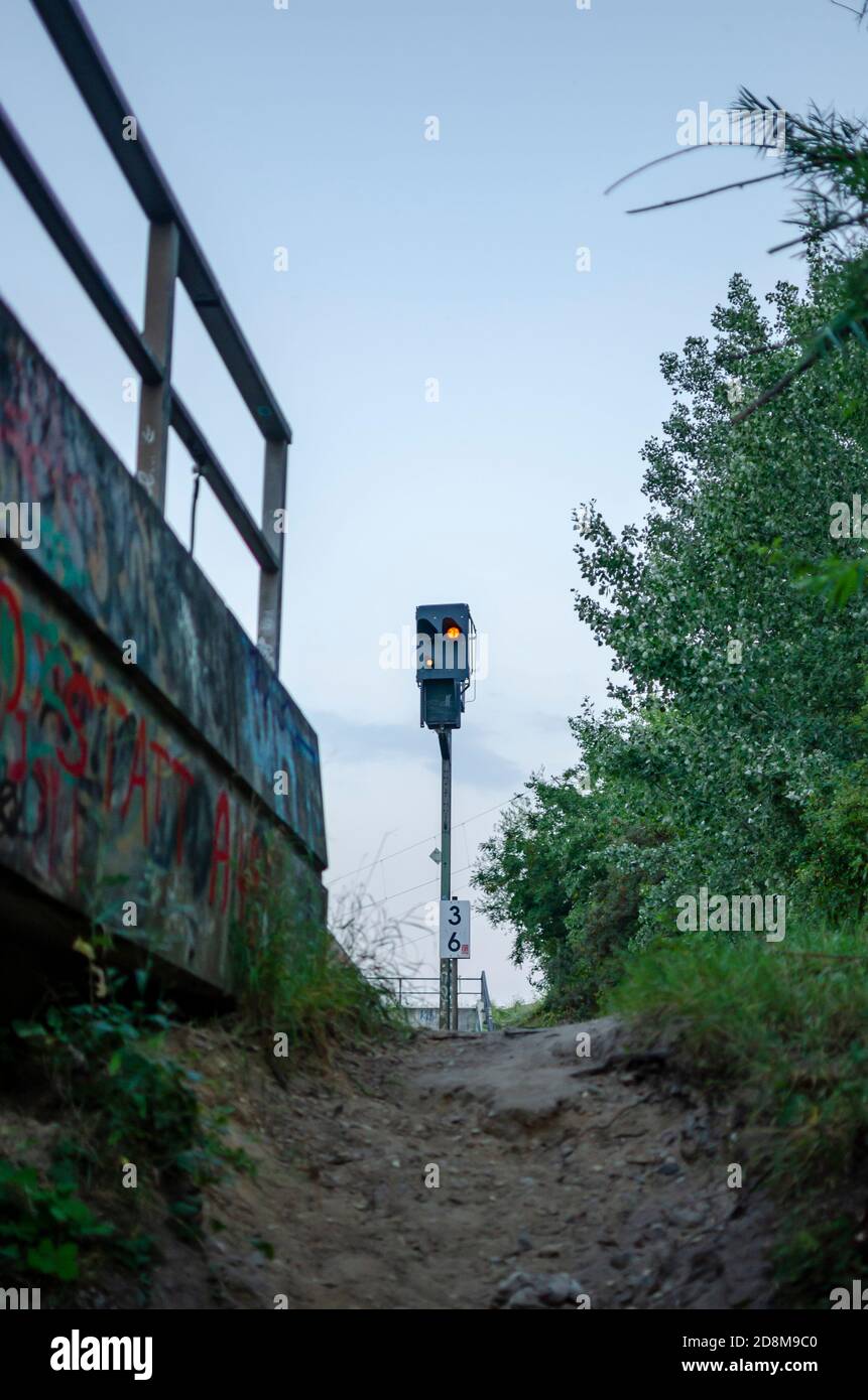 train signal by the tracks viewed from below Stock Photo - Alamy