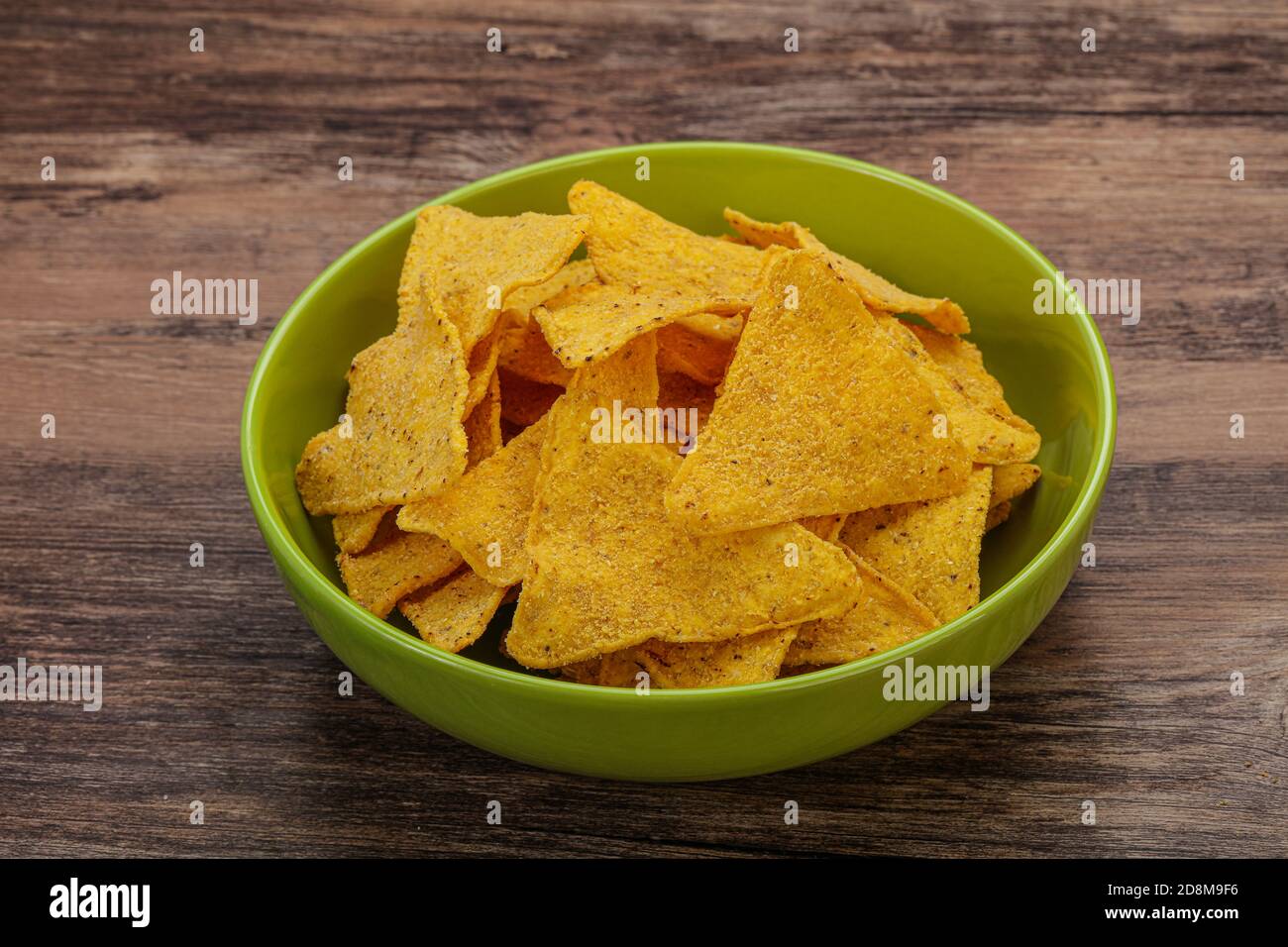 Mexican crunchy corn nachos triangle heap Stock Photo - Alamy