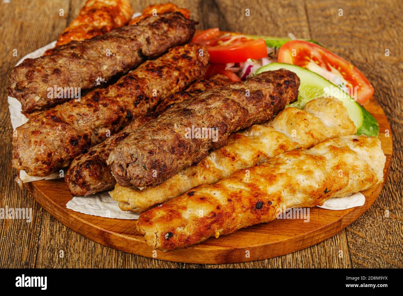 Tasty hot minced meat kebab set Stock Photo - Alamy