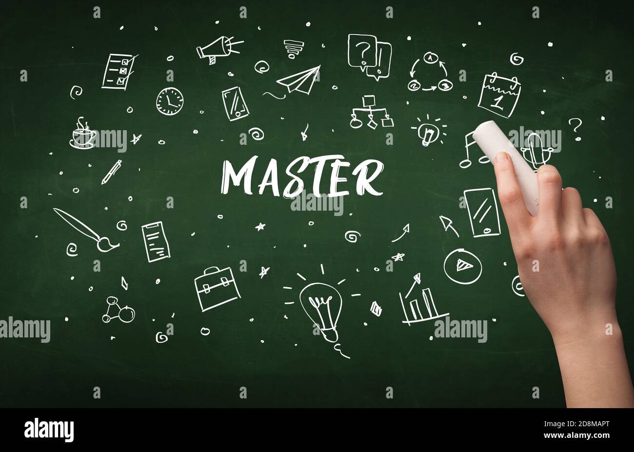 Hand drawing MASTER inscription with white chalk on blackboard ...