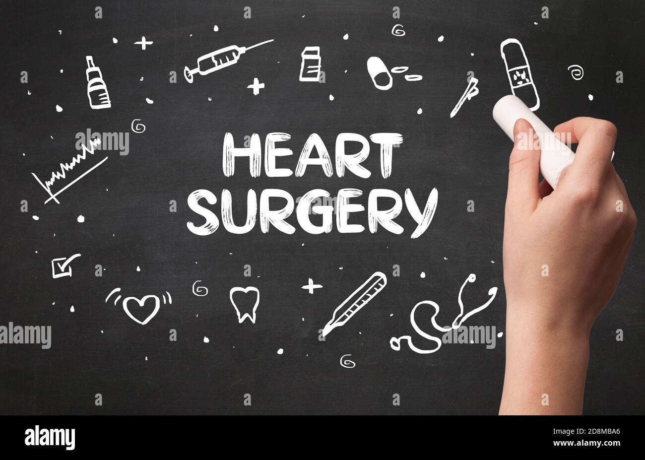 Hand drawing HEART SURGERY inscription with white chalk on blackboard ...