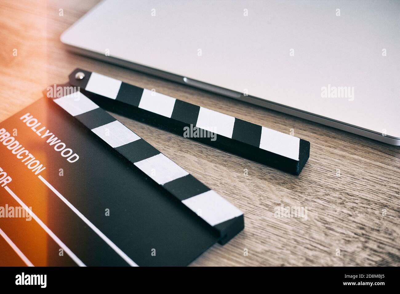 Movie clapper and laptop on the wood table Stock Photo - Alamy