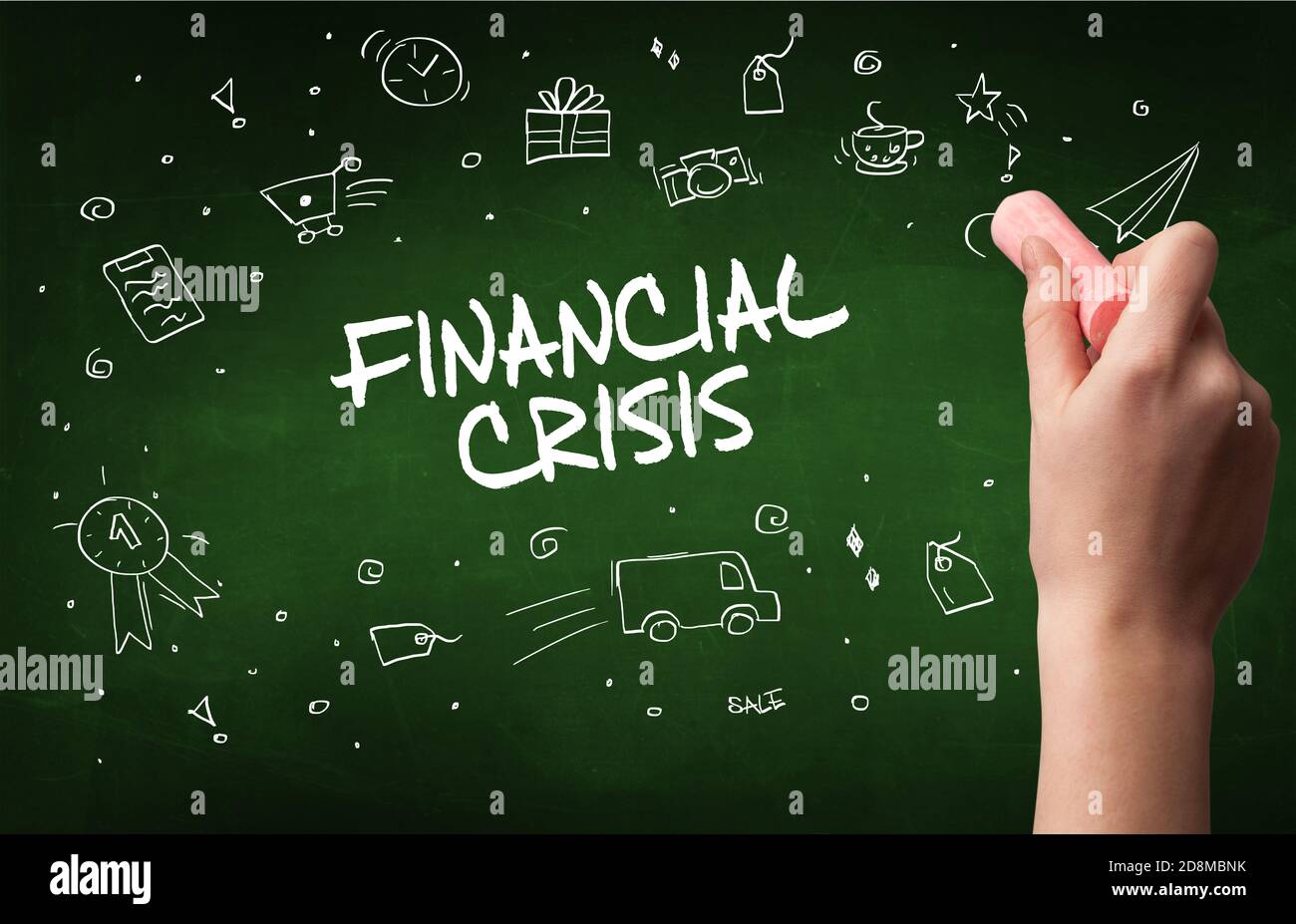 Hand drawing FINANCIAL CRISIS inscription with white chalk on ...