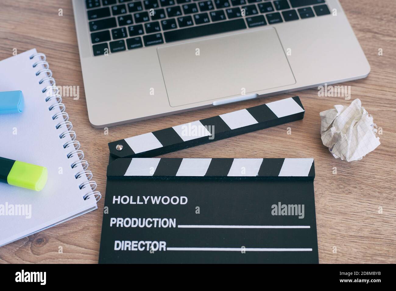 Video Editing,Movie clapper laptop and pencil notepad on the wood table ...