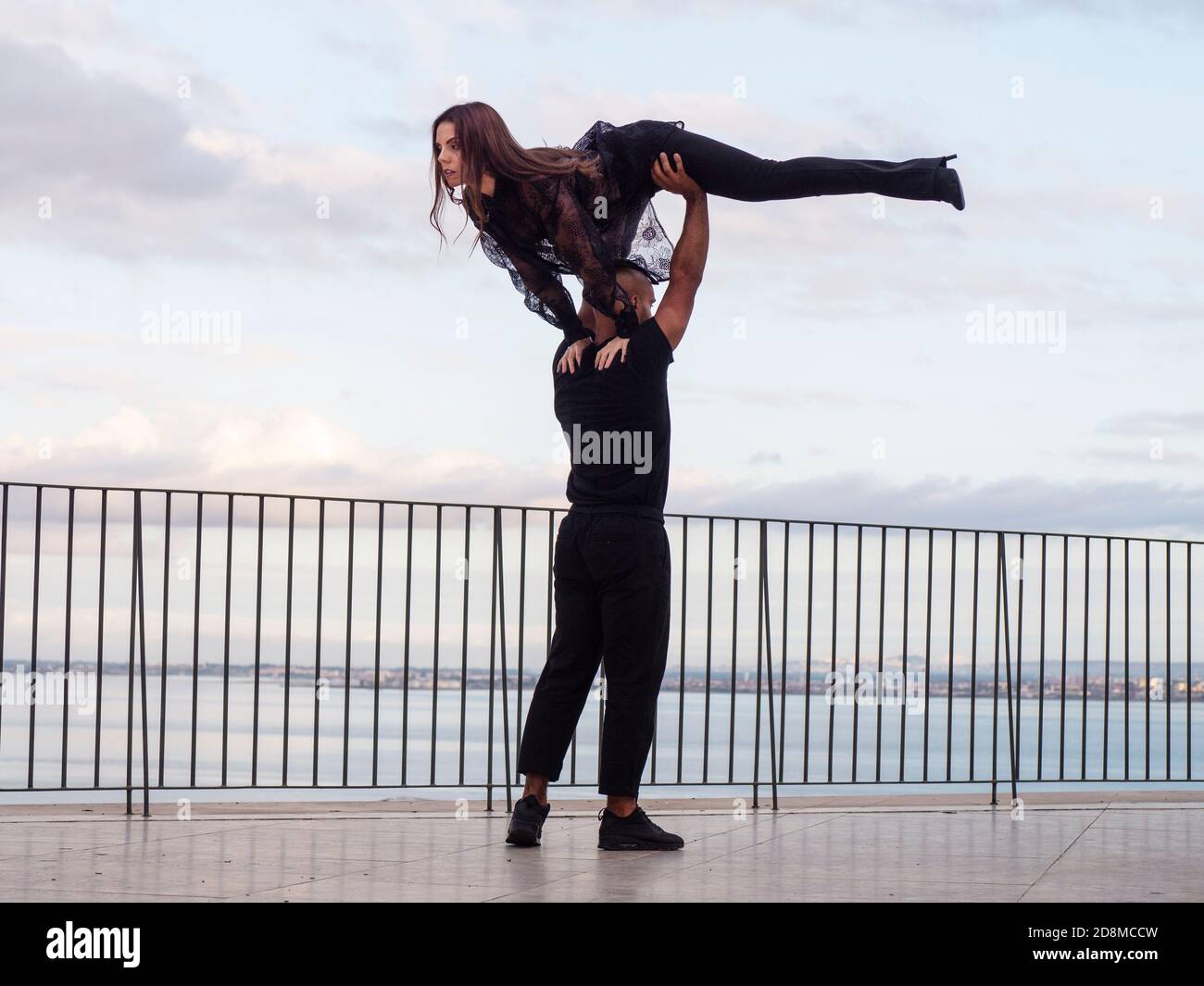 Male and female dancers doing an acrobatic pose Stock Photo - Alamy