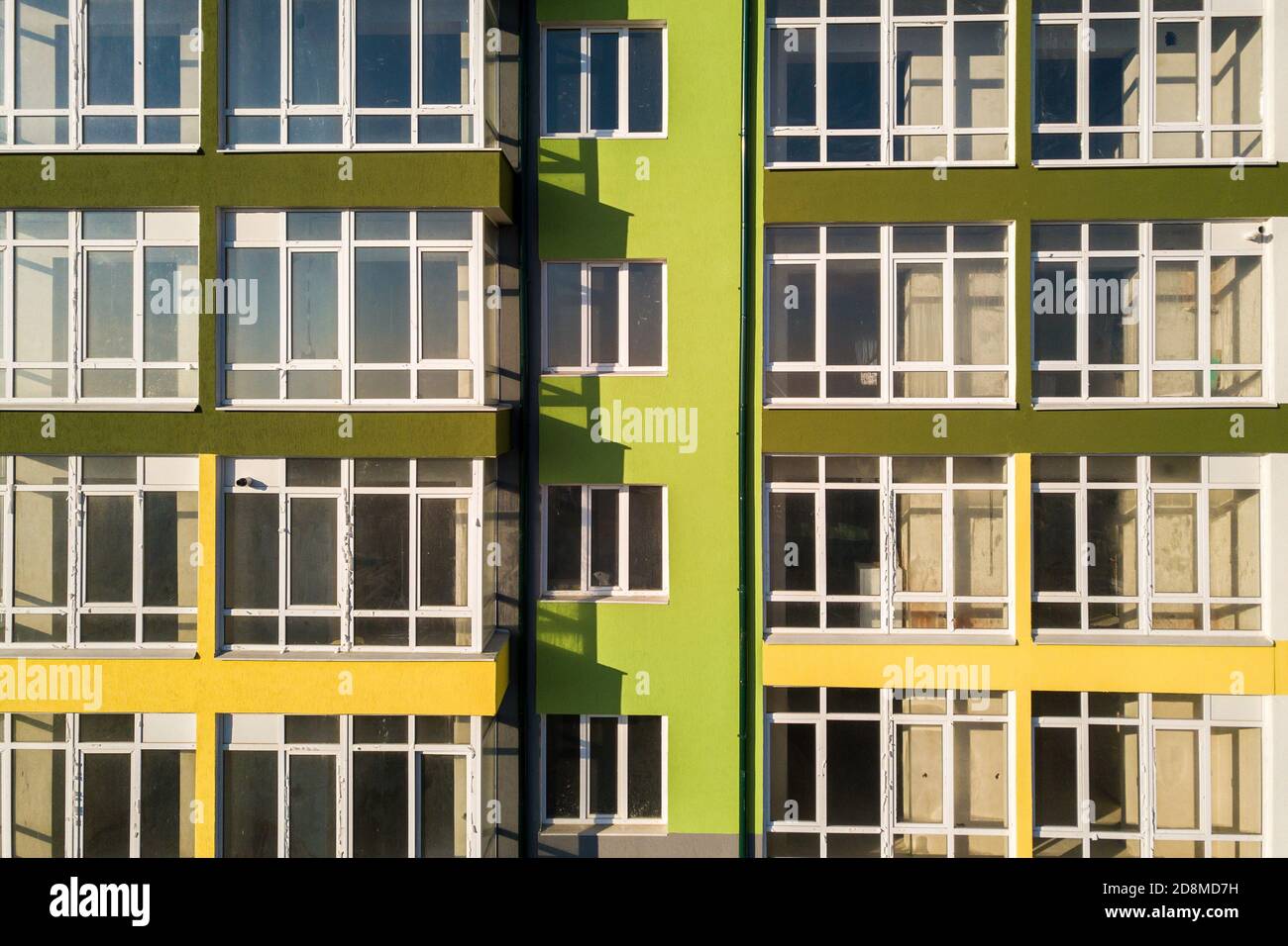 Aerial view of a tall residential apartment building with many windows ...