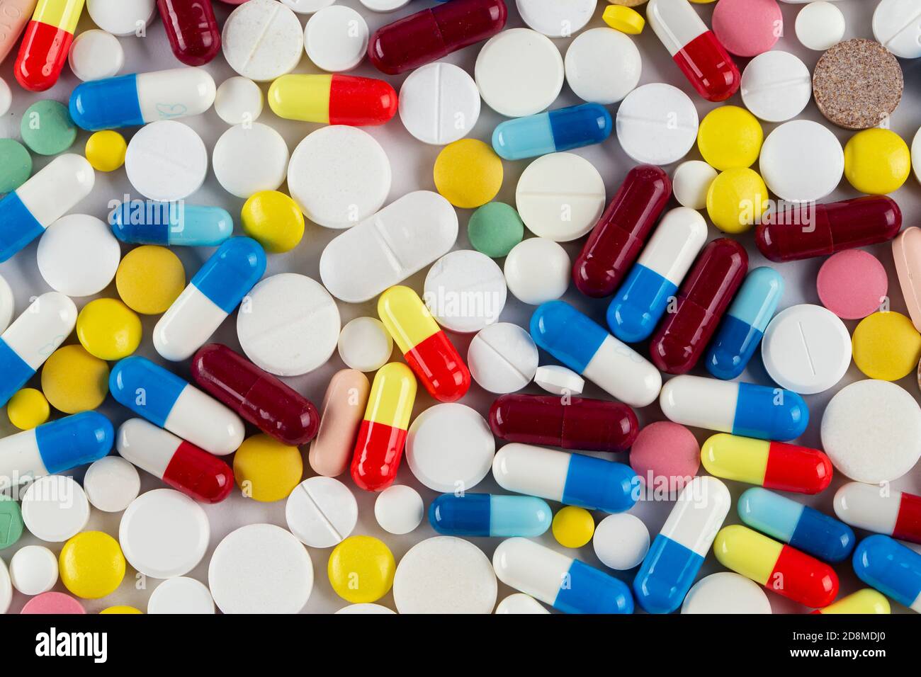 Many different pills on a white background. Medical concept. Concept of ...