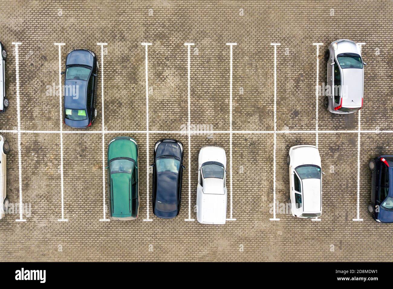 Top down aerial view of many cars on a parking lot of supermarket or on ...