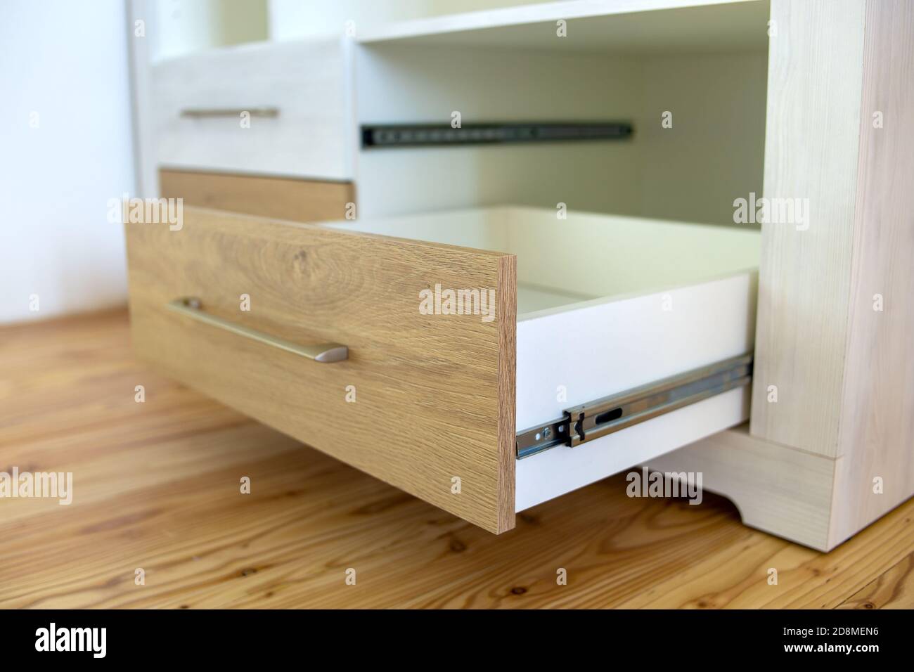 Close up of wooden drawer in contemporary cupboard cabinet Stock Photo ...