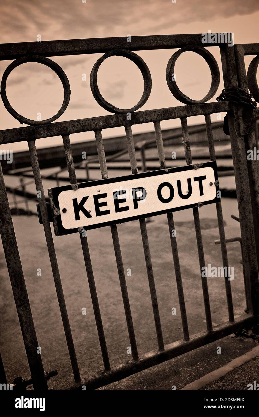 Old iron gate with keep out sign Stock Photo - Alamy